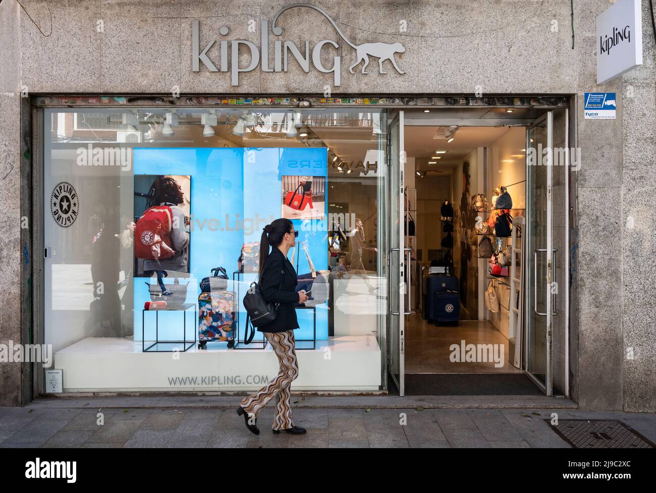 A pedestrian walks past the Belgian fashion brand Kipling store in ...