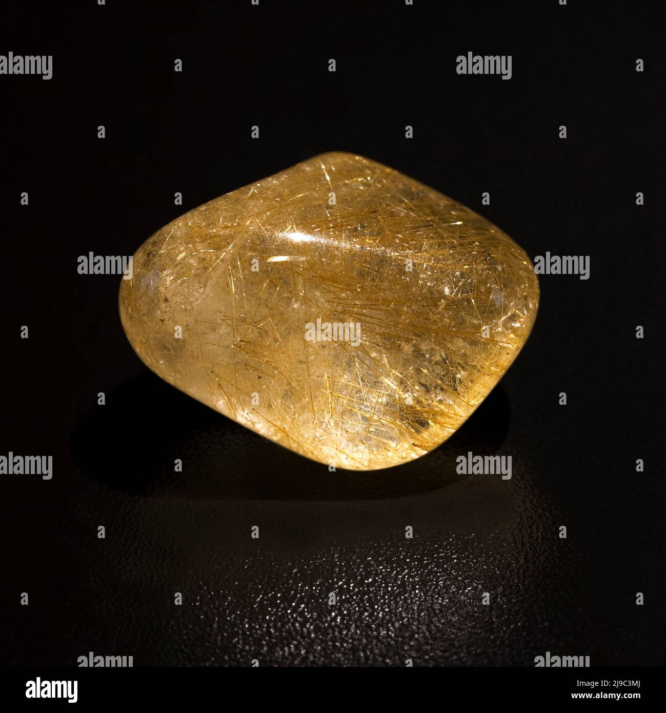 Macro close up colour photograph of 'Golden Rutilated Quartz' a semi ...
