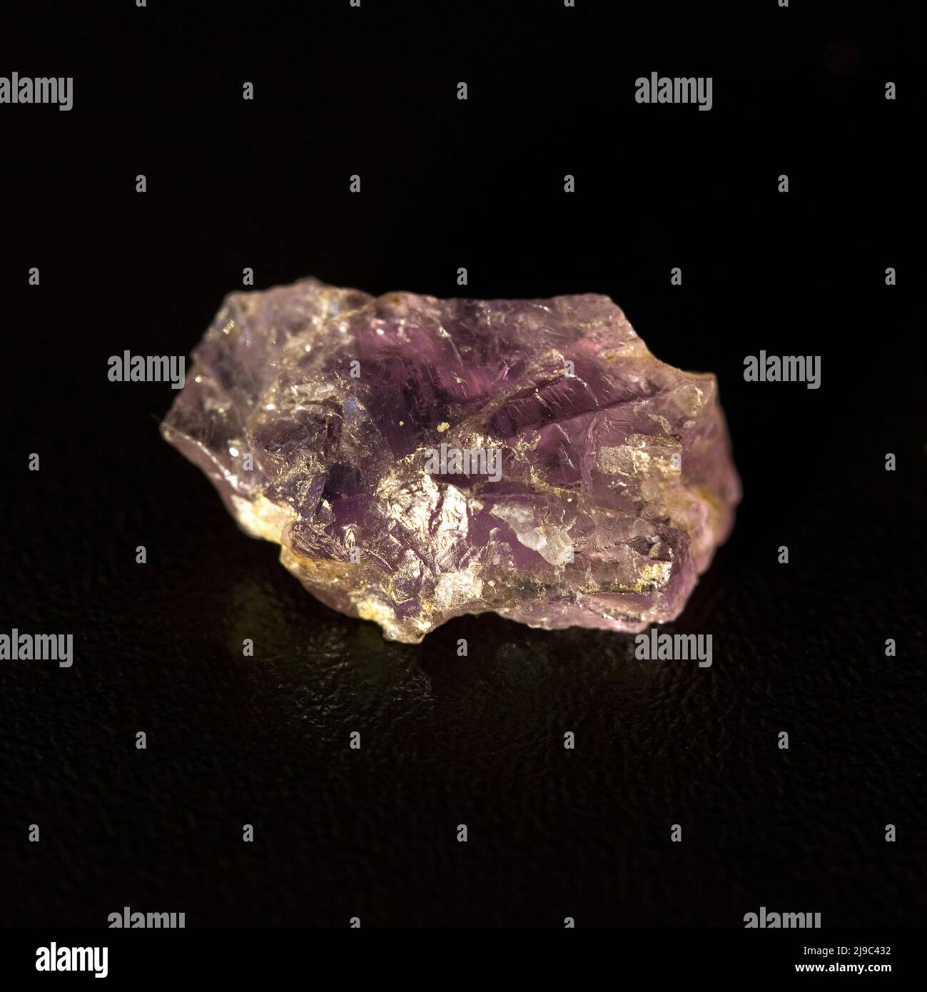 Macro close up colour photograph of 'Violet Scapolite' a semi precious ...