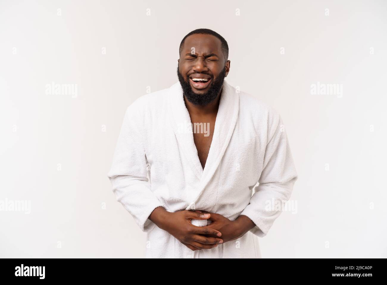 Closeup portrait of miserable, upset, young man, doubling over in ...