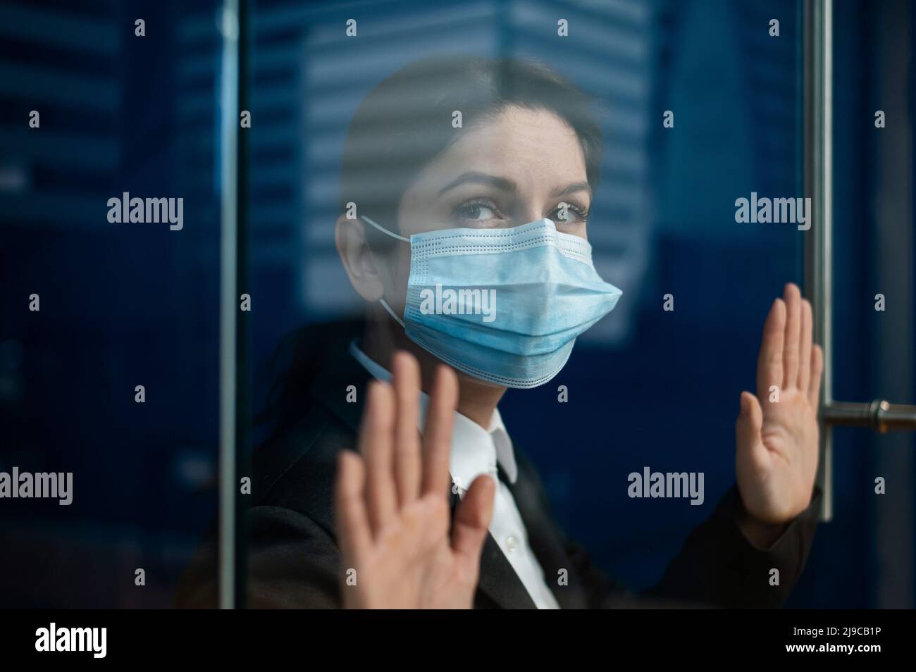 Hands against glass door hi-res stock photography and images - Alamy