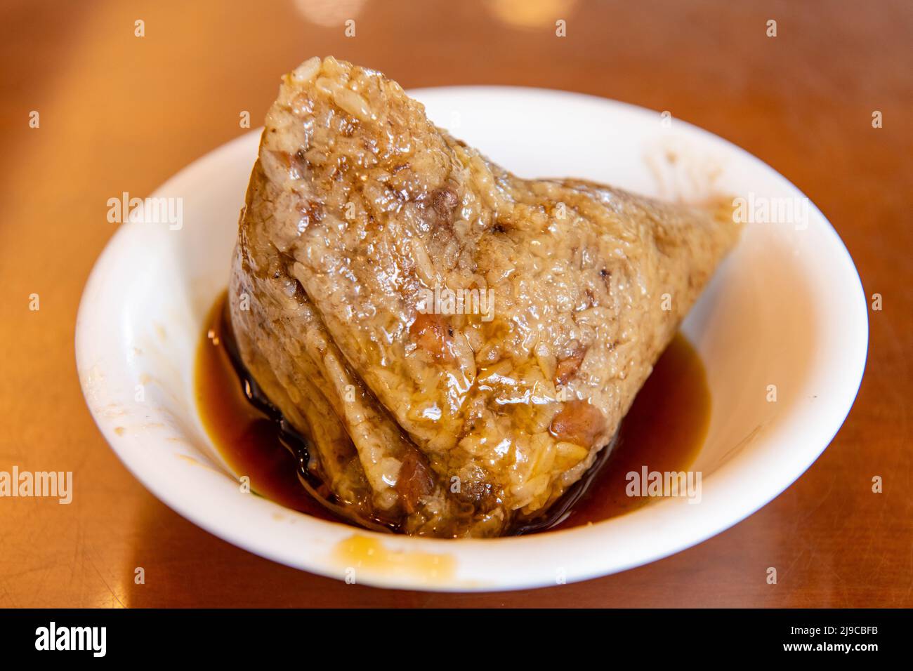 rice dumpling is a traditional Chinese rice dish made of glutinous rice ...