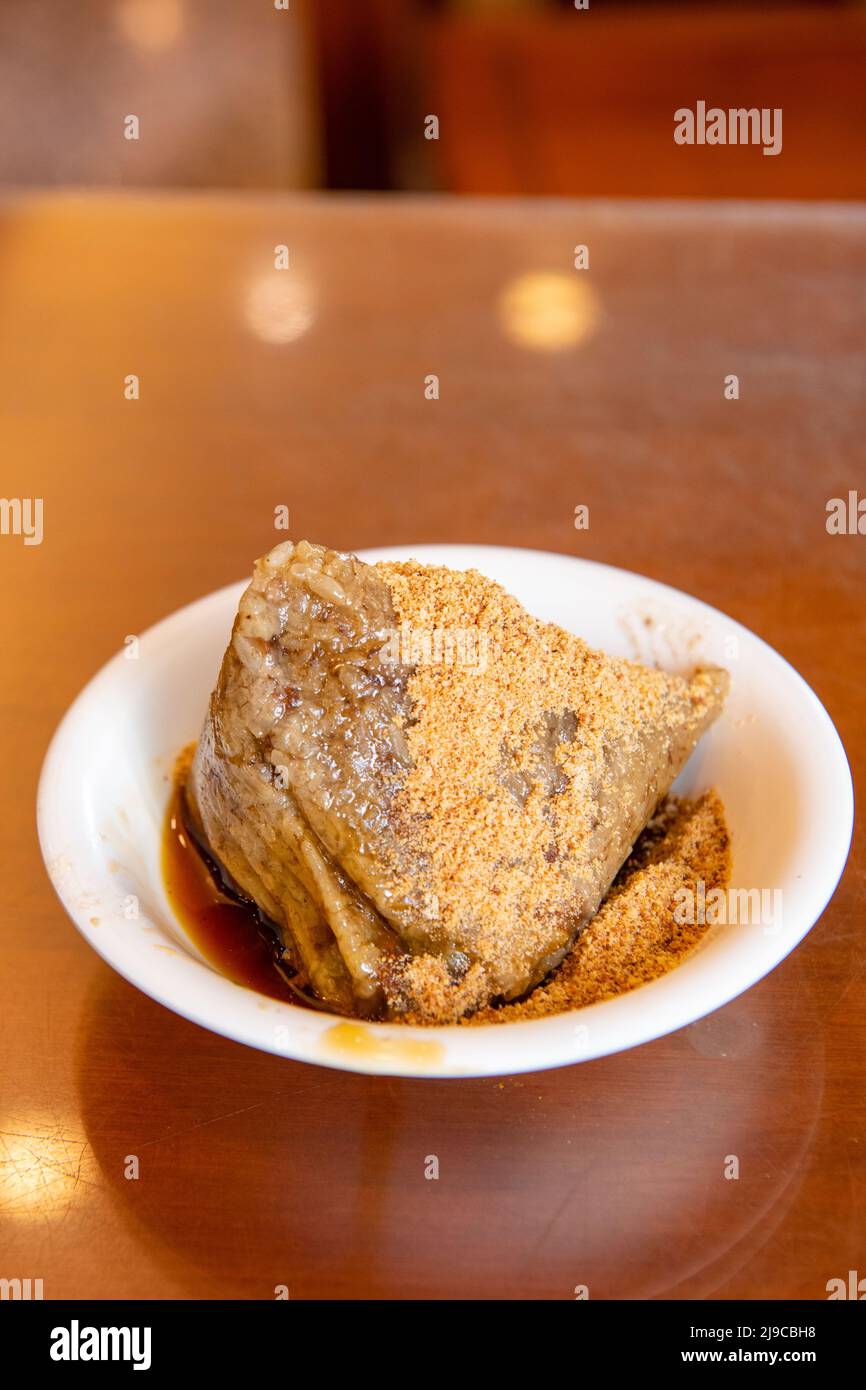 rice dumpling is a traditional Chinese rice dish made of glutinous rice ...