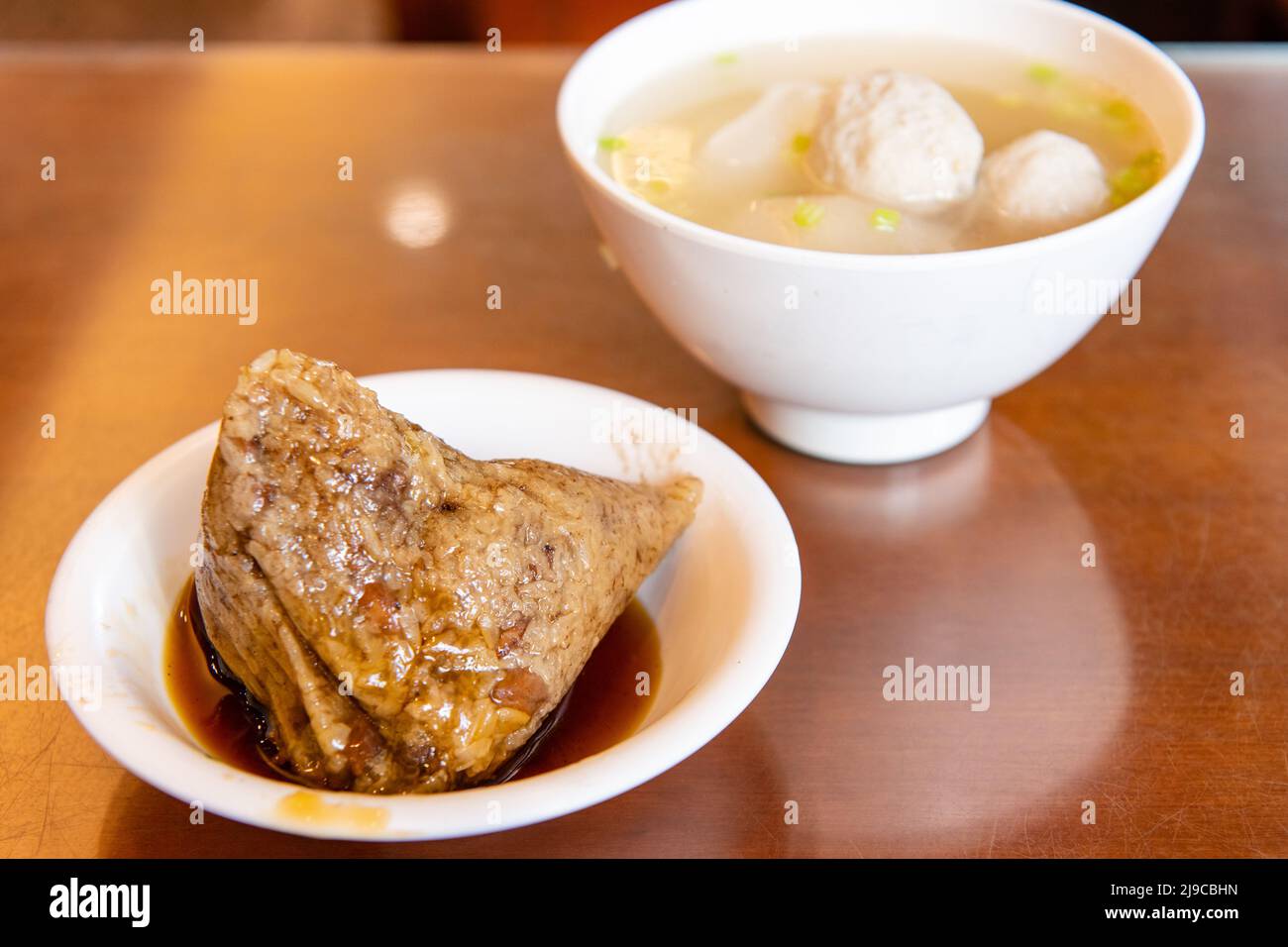 rice dumpling is a traditional Chinese rice dish made of glutinous rice ...