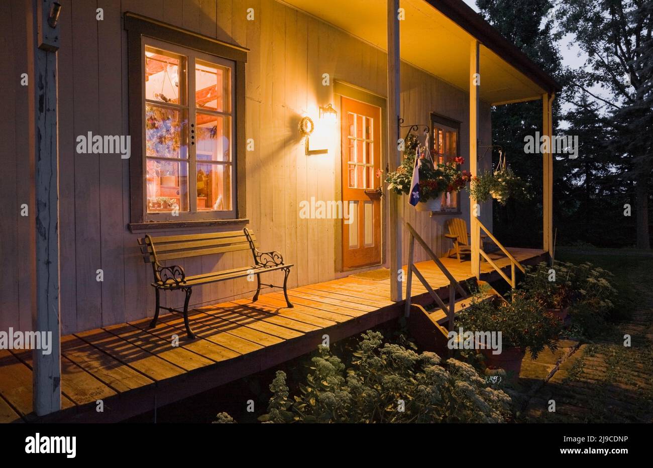 Old circa 1859 Canadiana cottage style home facade with wood plank ...