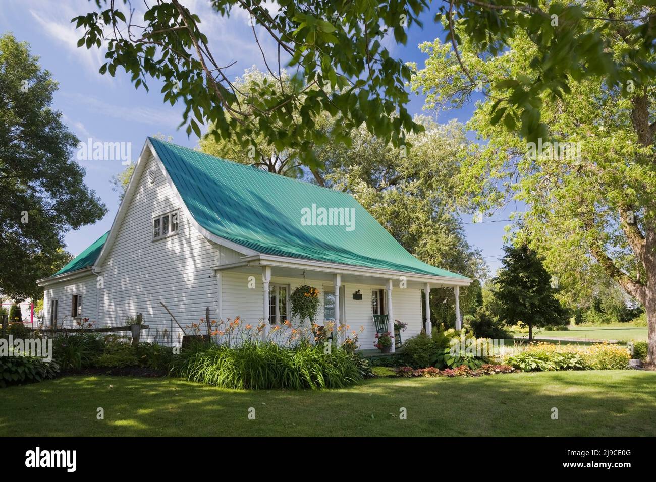 Old circa 1758 Canadiana cottage style home with white wood plank ...