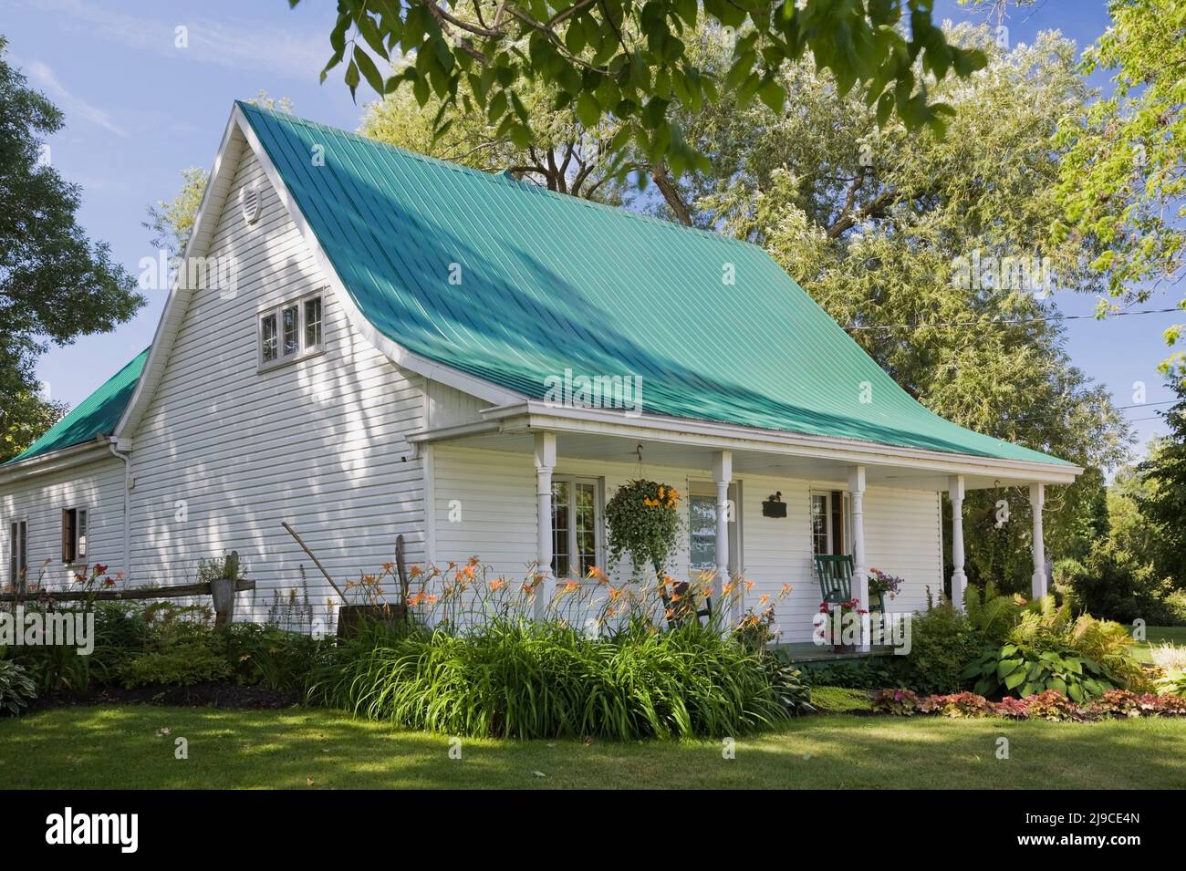 Old circa 1758 Canadiana cottage style home with white wood plank ...