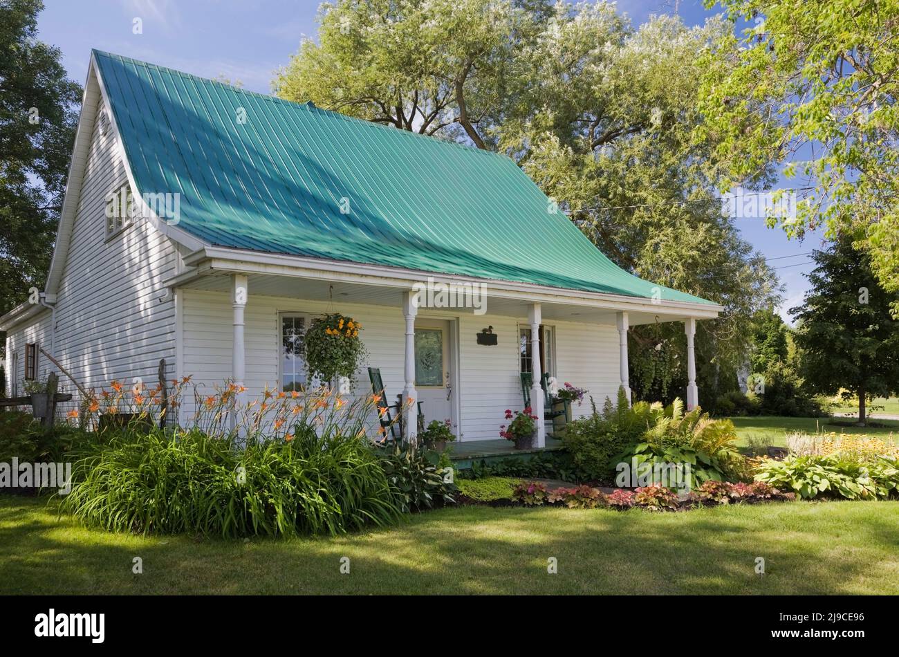 Old circa 1758 Canadiana cottage style home with white wood plank ...