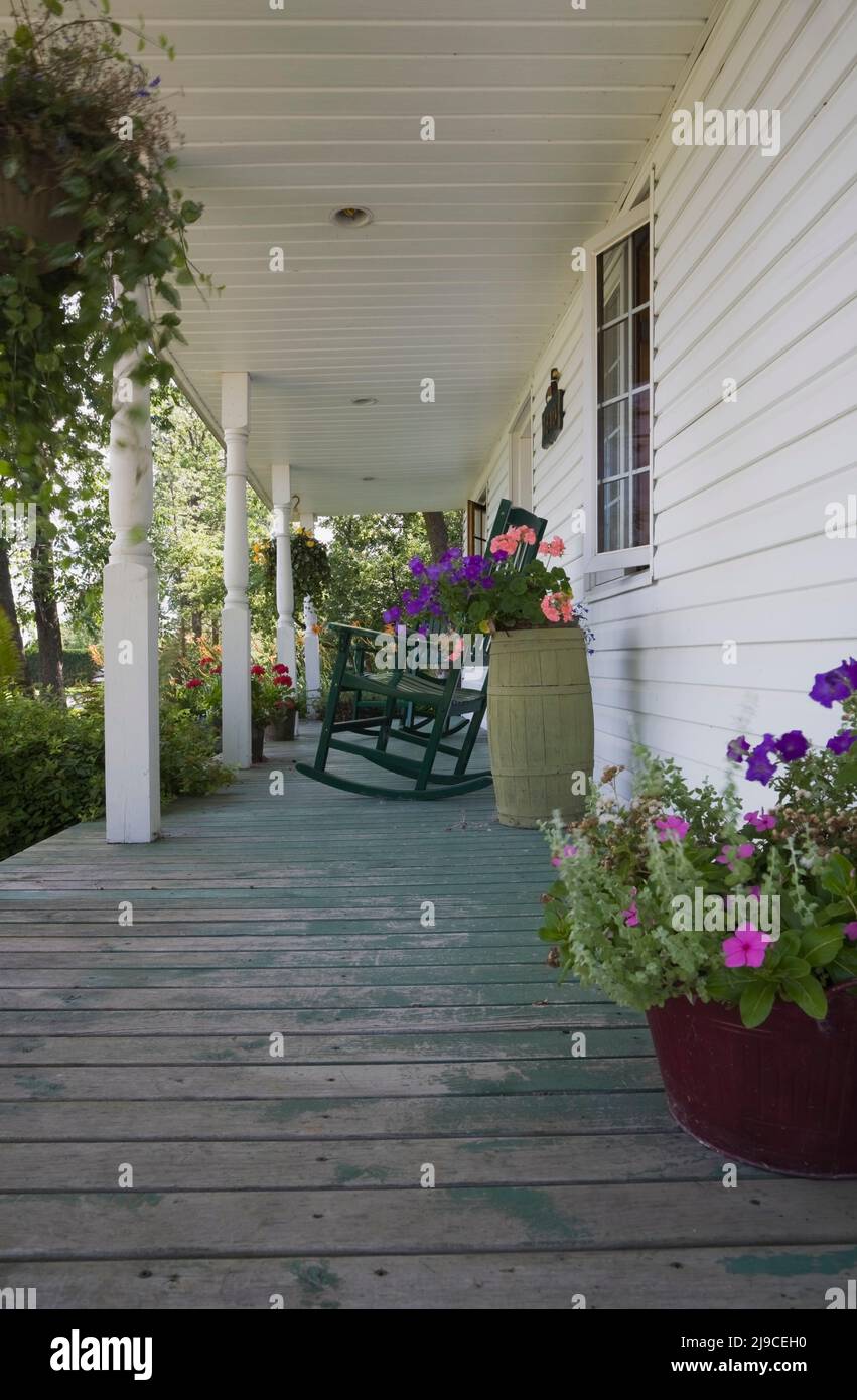 Veranda in front of old circa 1758 Canadiana cottage style home with ...