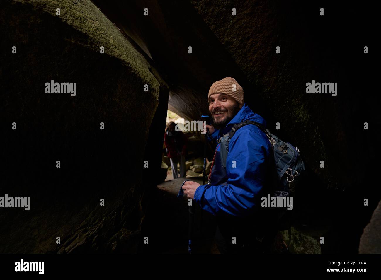 Cheerful male person having active journey on nature Stock Photo - Alamy