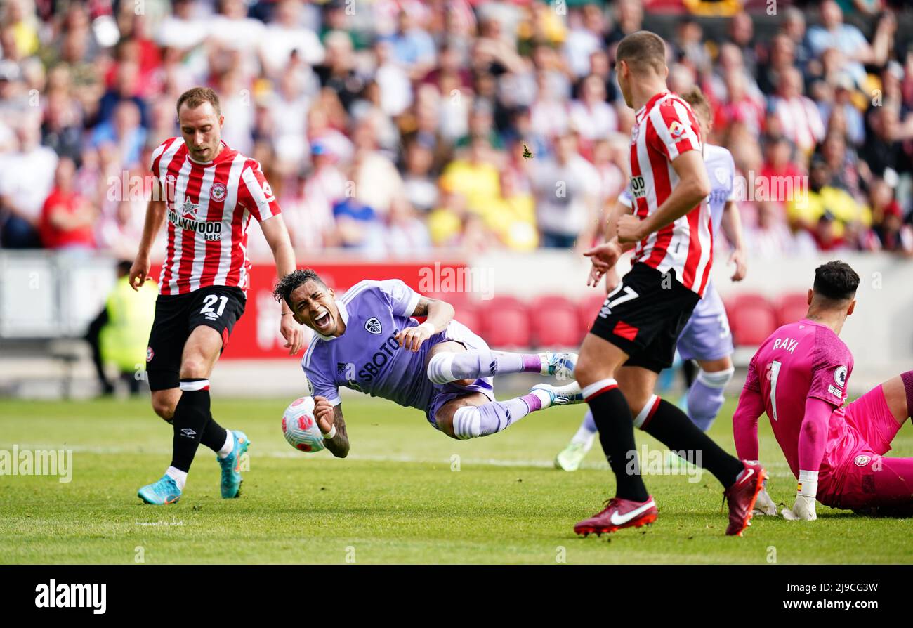 Leeds United's Raphinha is fouled by Brentford goalkeeper David Raya Martin, resulting in a ...
