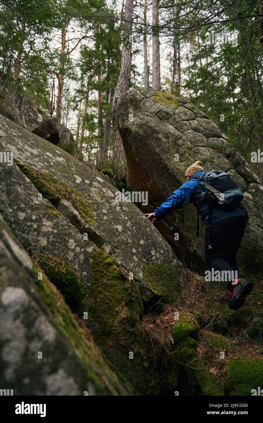 Strong man having adventure in the mountains Stock Photo - Alamy