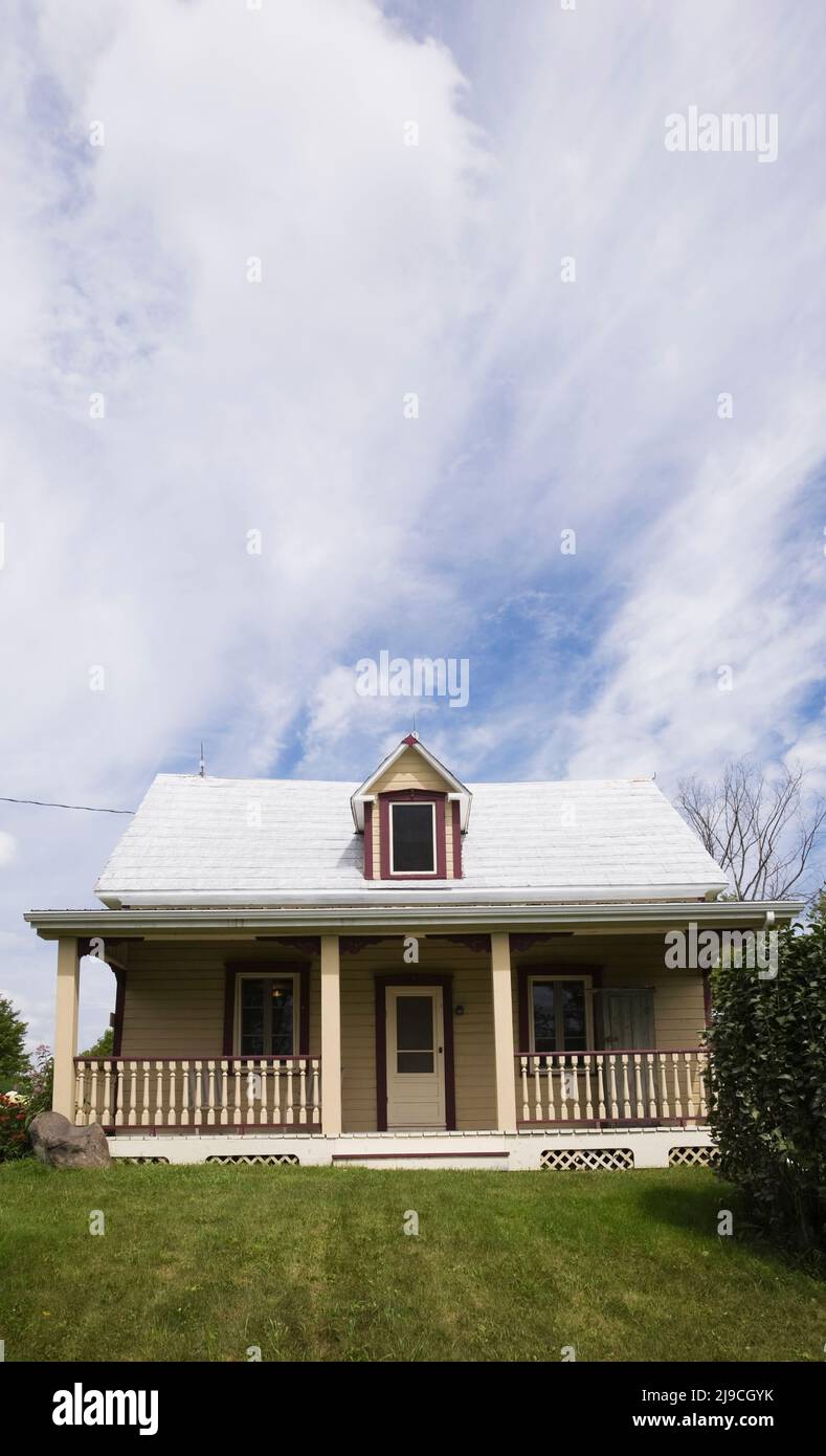 Old circa 1850 Canadiana cottage style home with beige wood plank ...