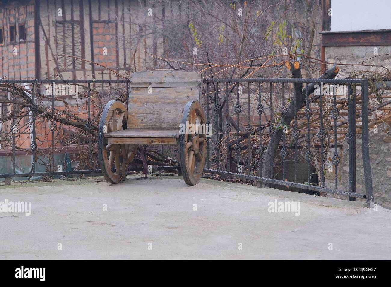 Small wooden chair and wheels, wheelchair made of stone material Stock ...