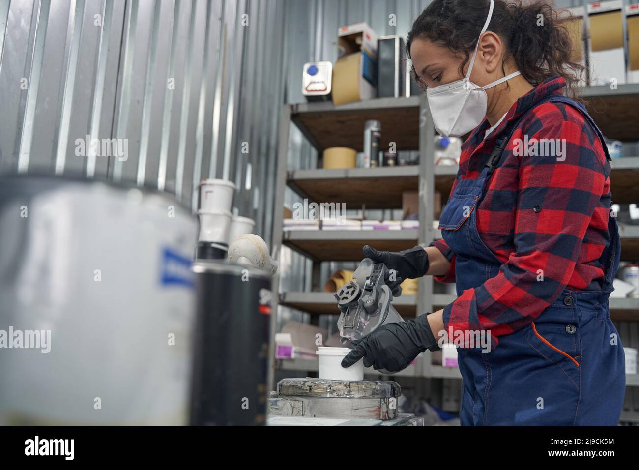 Serious master preparing necessary color for car repaint Stock Photo ...