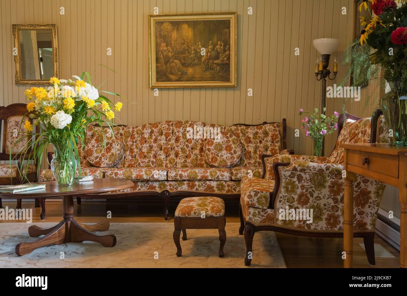 Antique coffee table, sofa, armchair with flowery patterns and ...