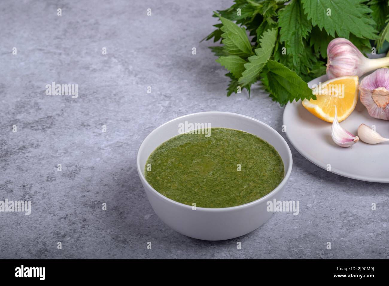 Spring nettle soup and wild, onion, lemon Stock Photo - Alamy