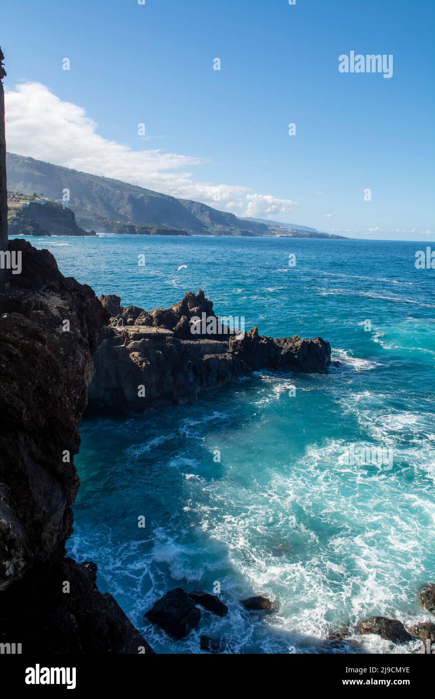 View on black lava rocks in small fisherman village Punta Brava near ...