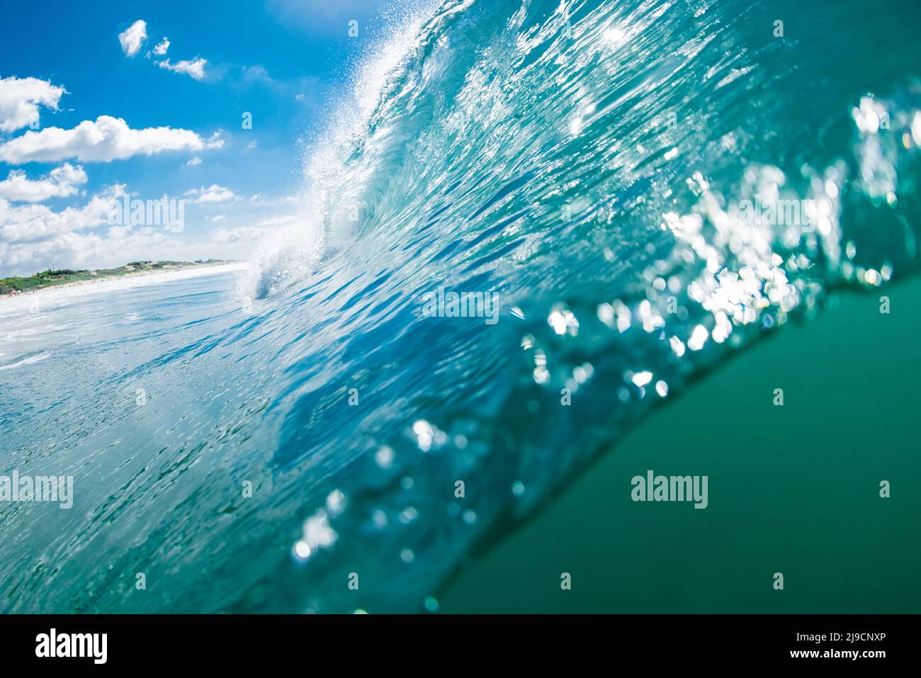 Close up view of turquoise wave in ocean. Barrel wave with sunshine ...