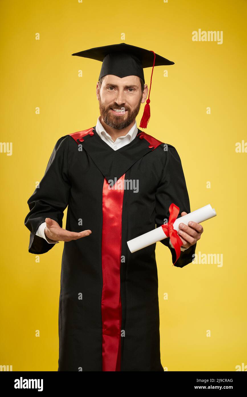 Front view of proud, cheerful student graduating from university. Young ...