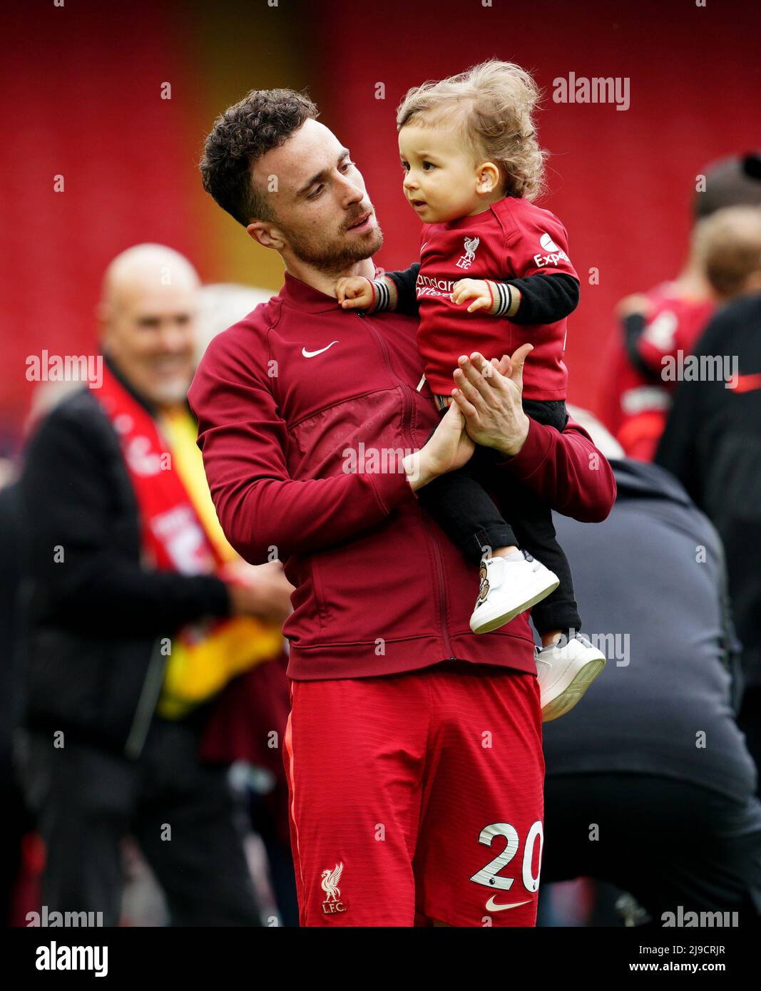 Liverpool's Diogo Jota walks the pitch with his family after the ...