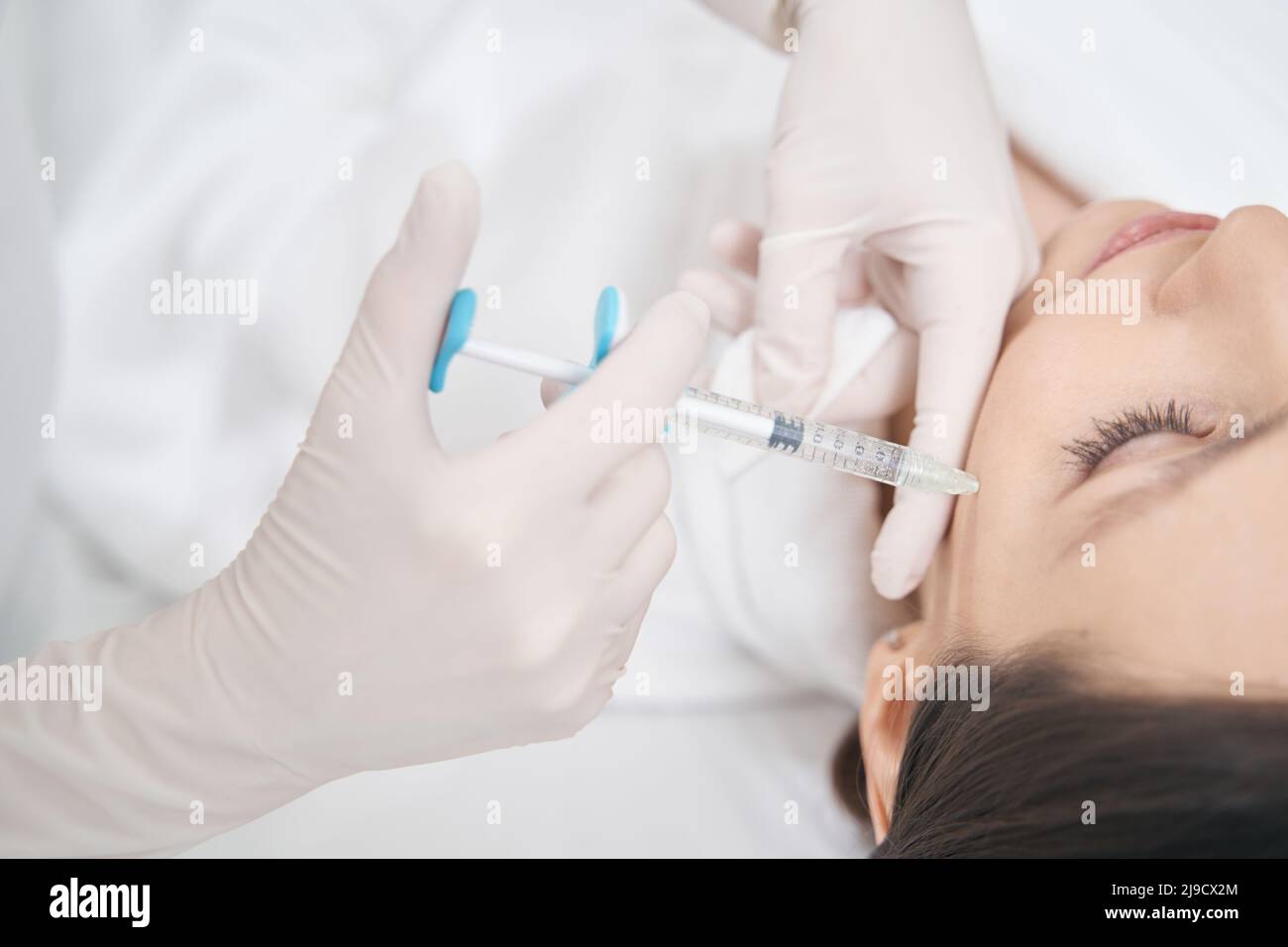 Beautician making rejuvenating facial hi-res stock photography and ...