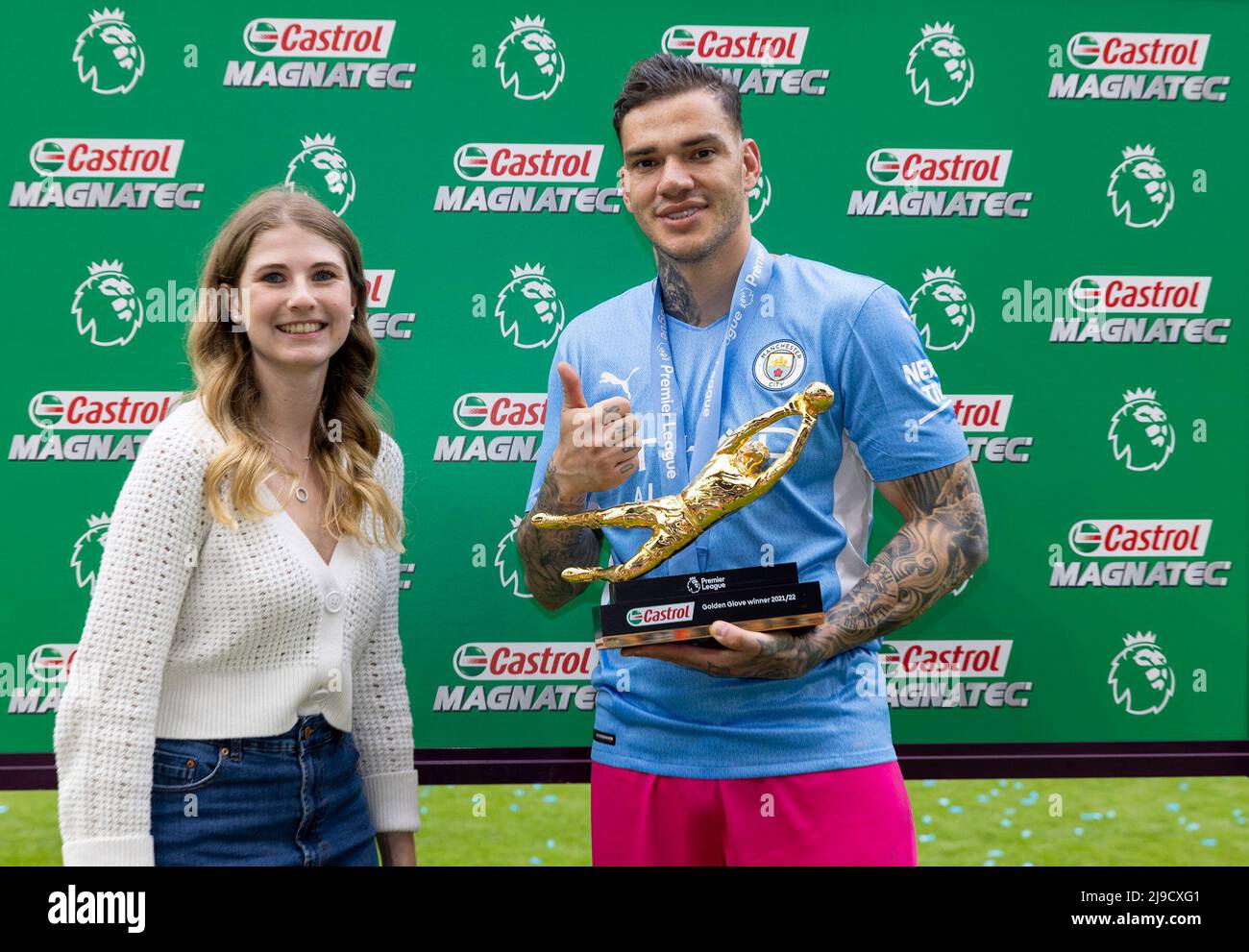 Manchester City's Ederson is presented with the Premier League Golden ...