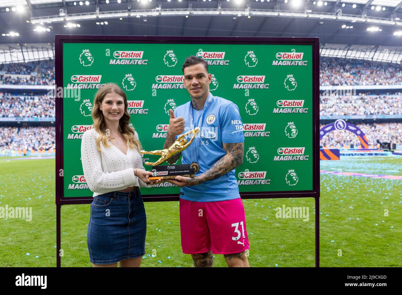 Manchester City's Ederson is presented with the Premier League Golden ...