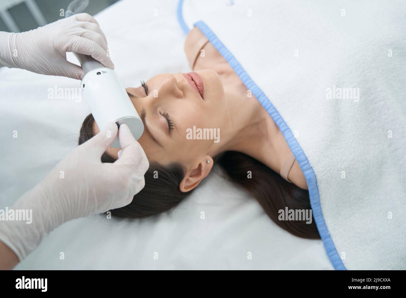 Rejuvenation of female forehead skin during endosphere therapy Stock ...