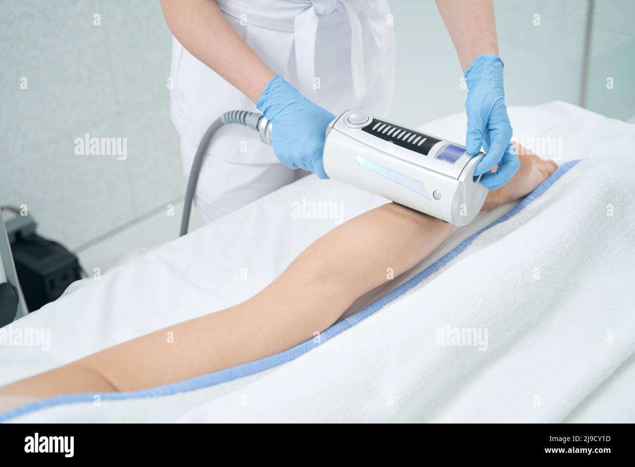 Beauty salon visitor getting leg skin endosphere therapy Stock Photo ...
