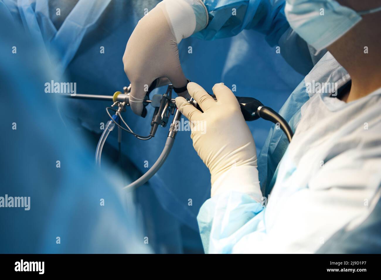 Hand of surgeon holding laparoscopic equipment for minimally invasive ...