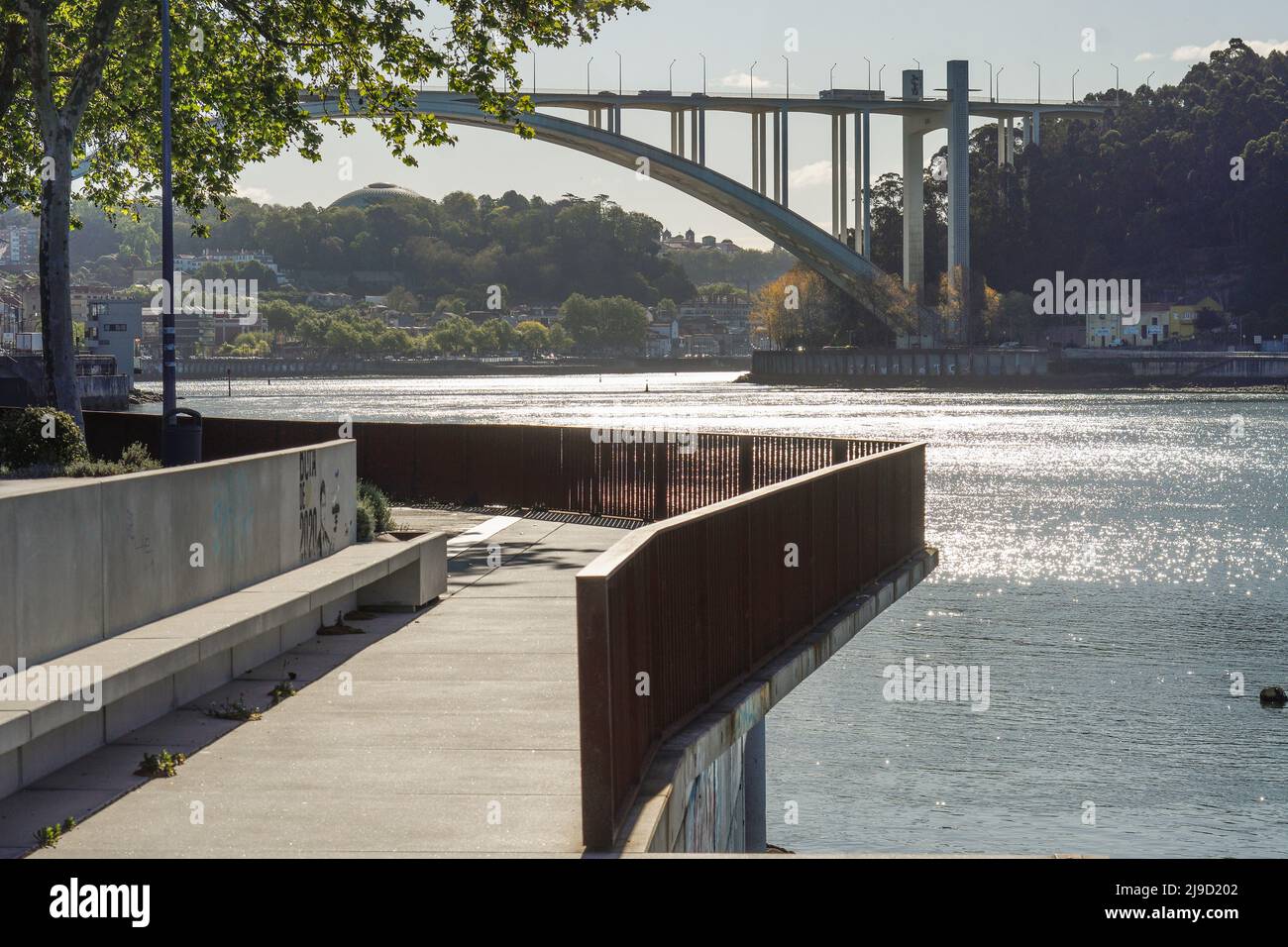 Arrabida Bridge over the Douro River in Porto backlit Stock Photo - Alamy