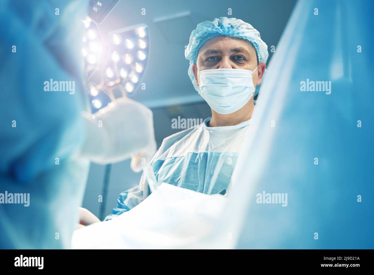 Man surgery expert staring straight during laparoscopic operation Stock ...