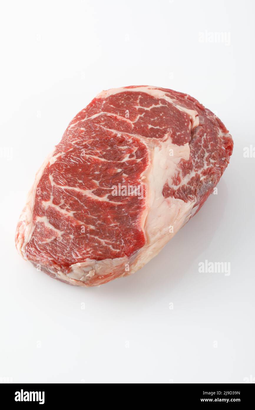 Ribeye steak. Raw meat isolated on white background Stock Photo - Alamy