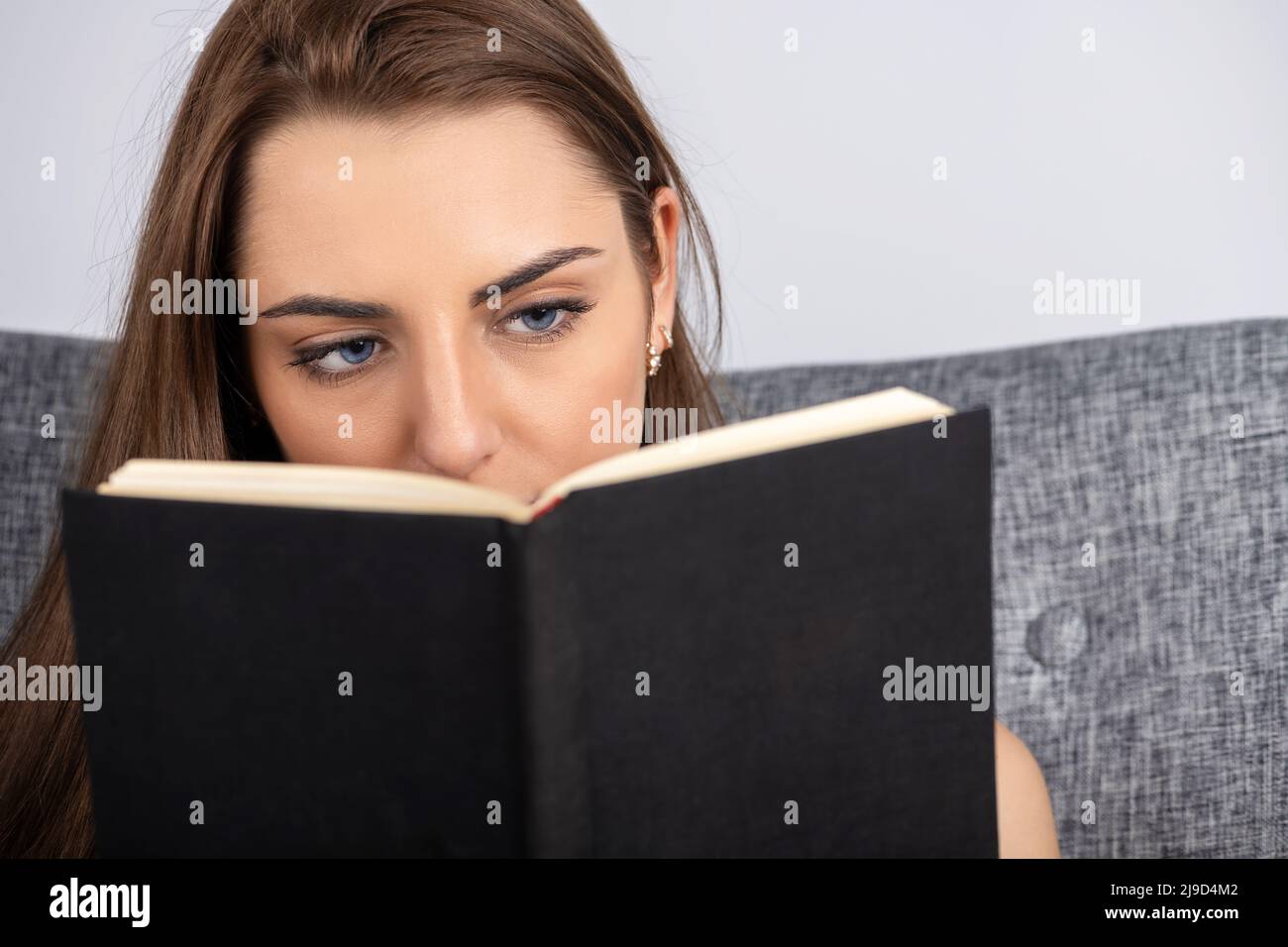 Leisure and hobbies concept. Portrait of beautiful brunette woman with ...