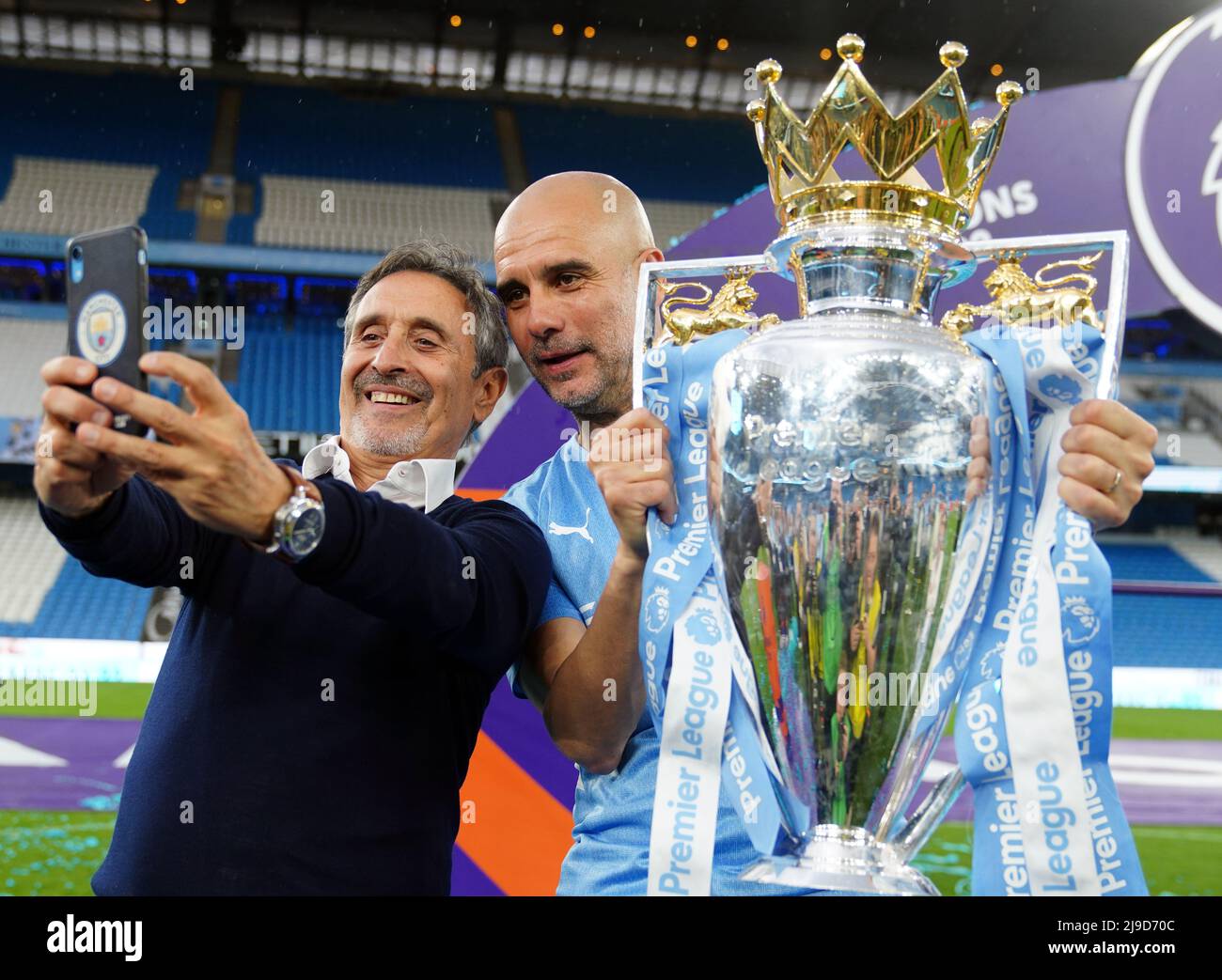 Manchester City manager Pep Guardiola (right) with the Premier League ...