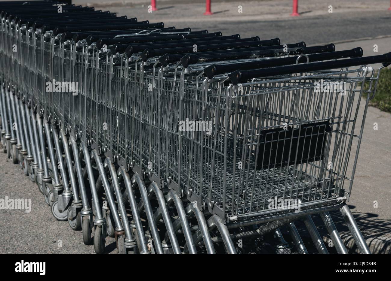 shopping carts together in a line up. trolleys from the supermarket ...