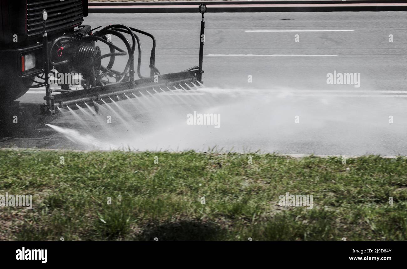 Water road sprinkler hi-res stock photography and images - Alamy