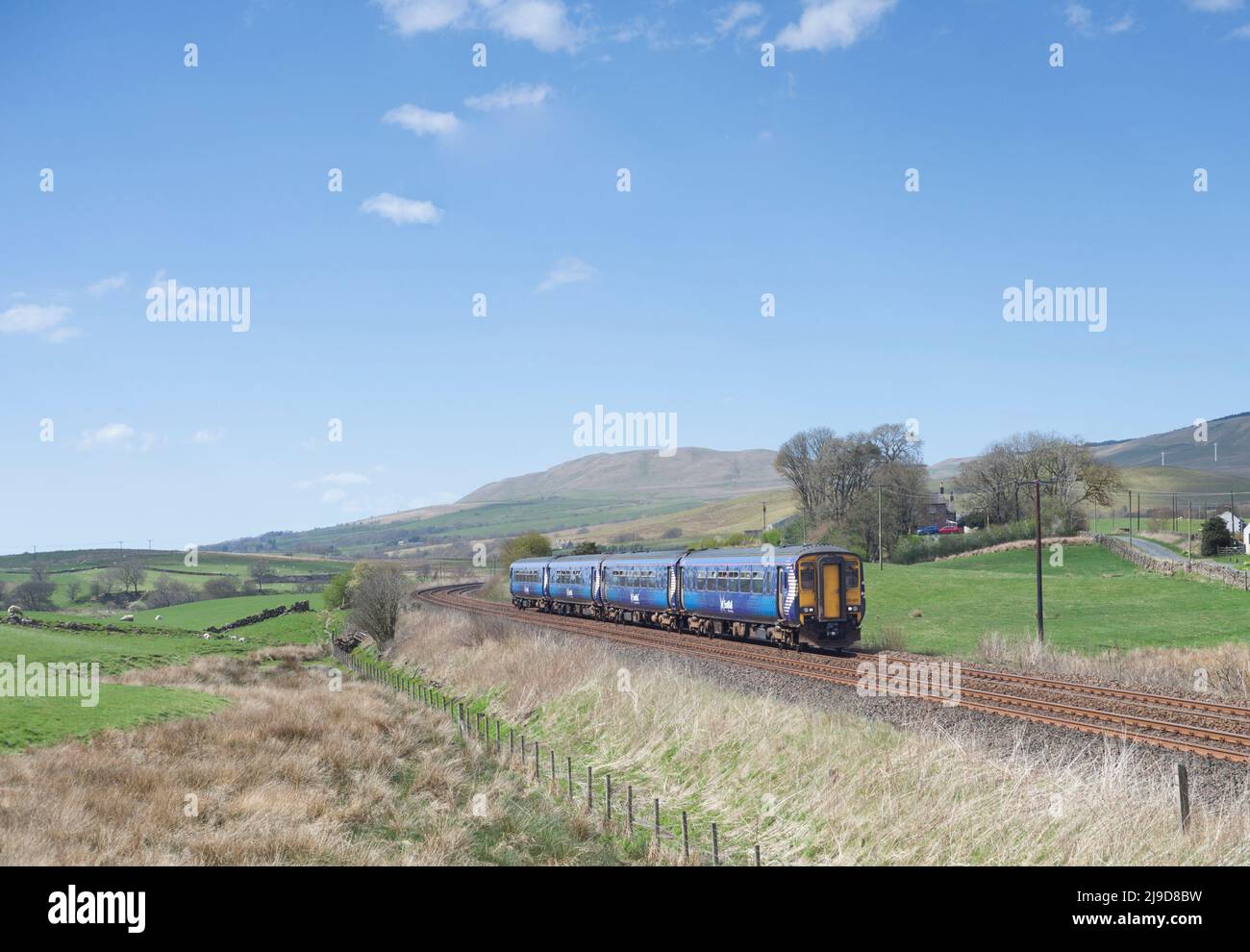 2 Scotrail class 156 sprinter trains running through the countryside ...