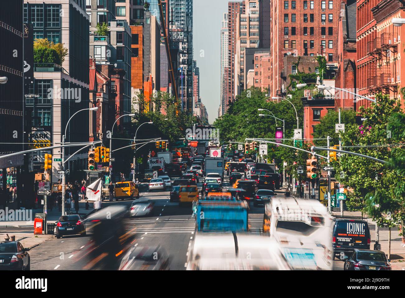 View down 10th Ave from High Line bridge in Chelsea, New York City ...