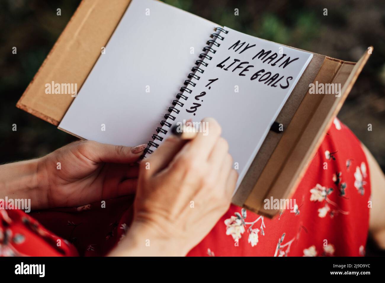 Main life goals, How to Set and Achieve Life Goals. Female hands write ...
