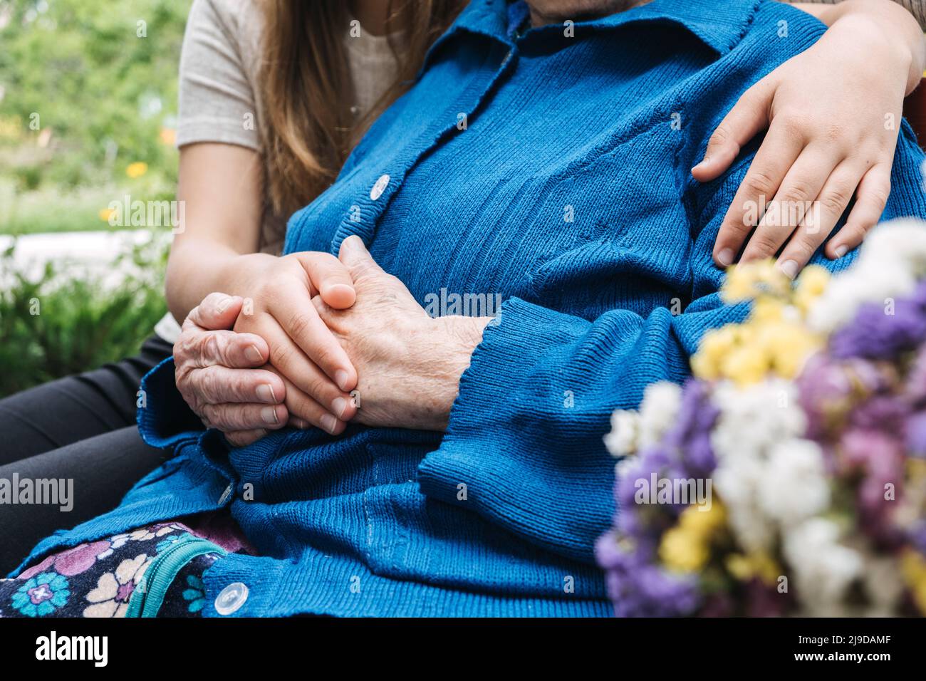 Charities for Elderly People. Young hands holding old elderly senior ...