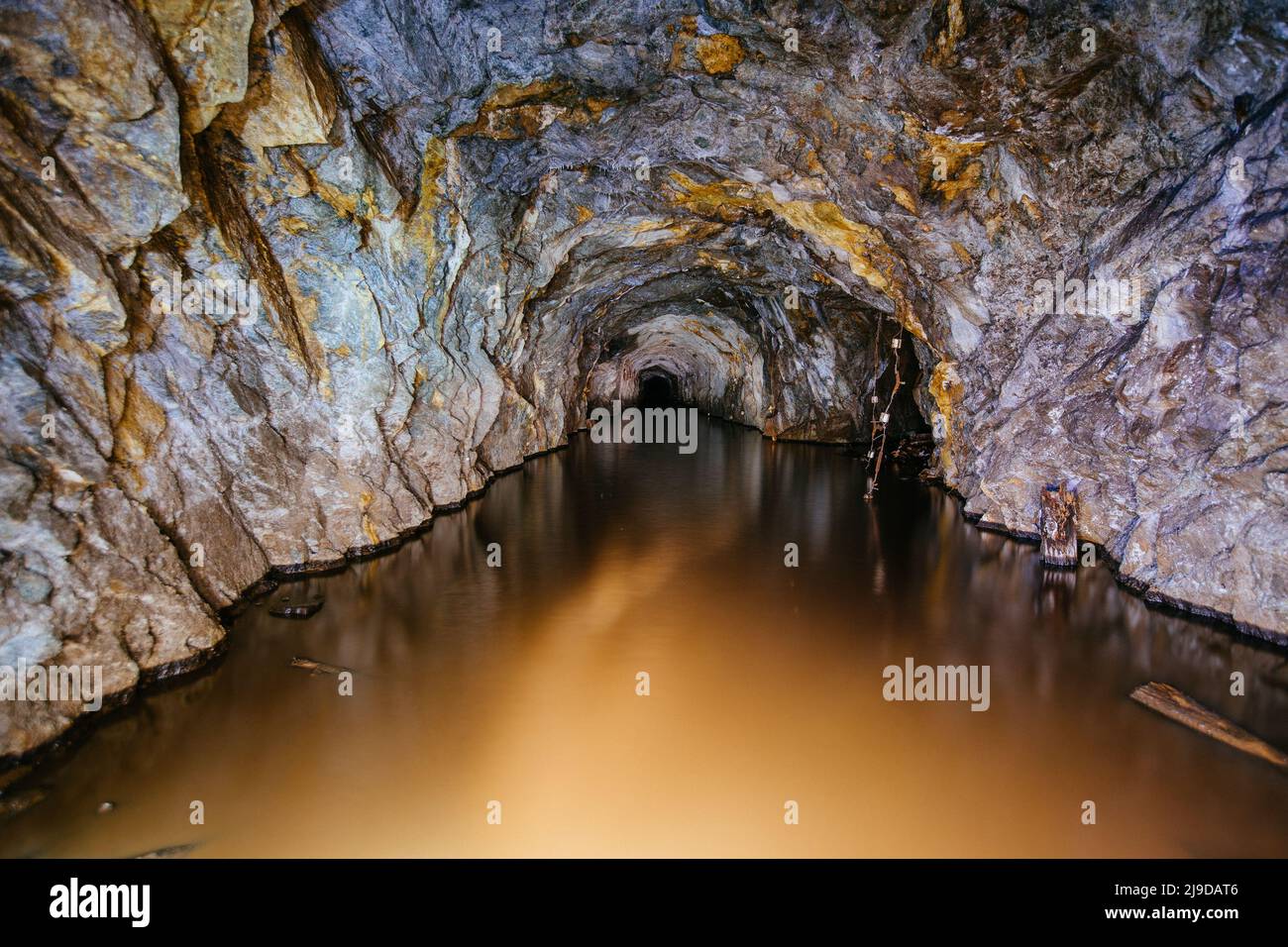 Dark flooded abandoned mine tunnel Stock Photo - Alamy