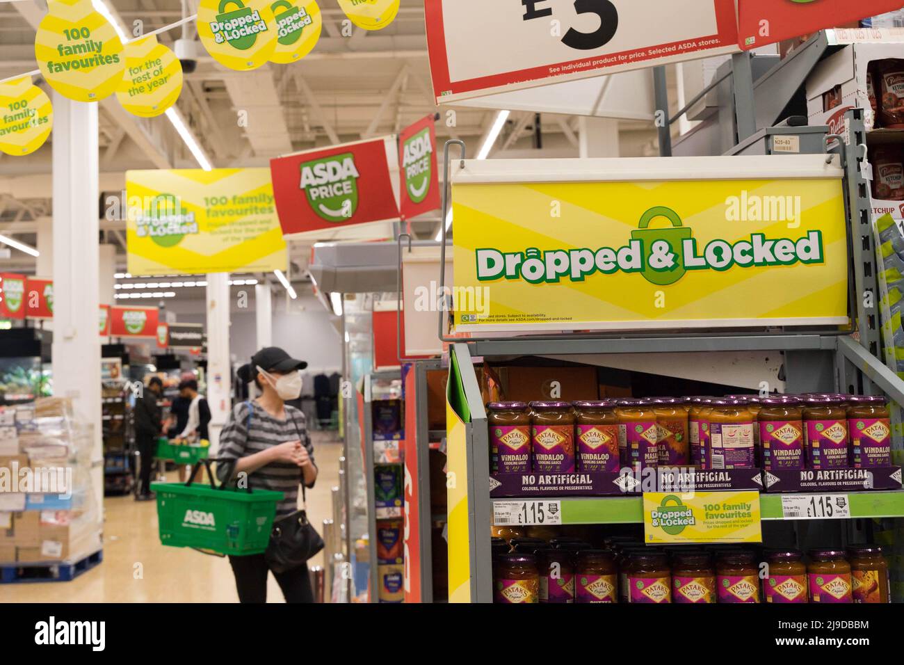 woman shopper wearing facemask at ASDA supermarket London, England ...