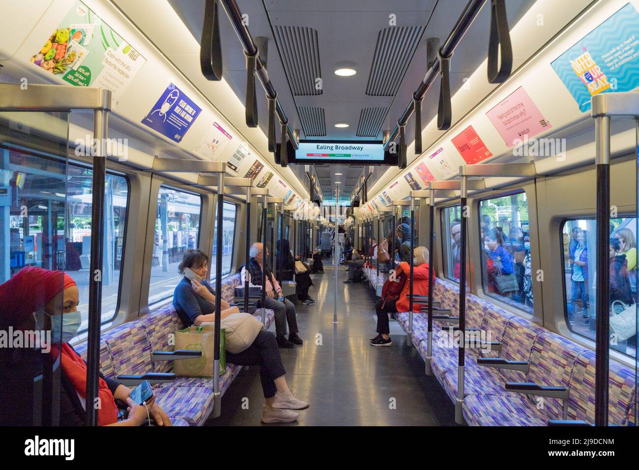 train carrige full of passengers on Elizabeth line, purple crossrail ...