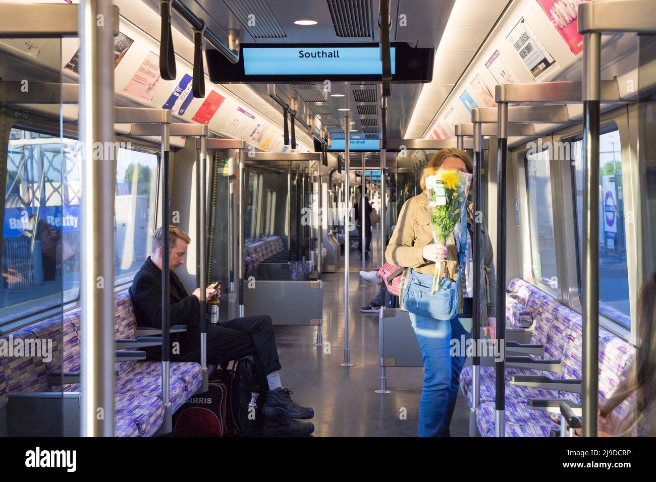 train carrige full of passengers on Elizabeth line, purple crossrail ...