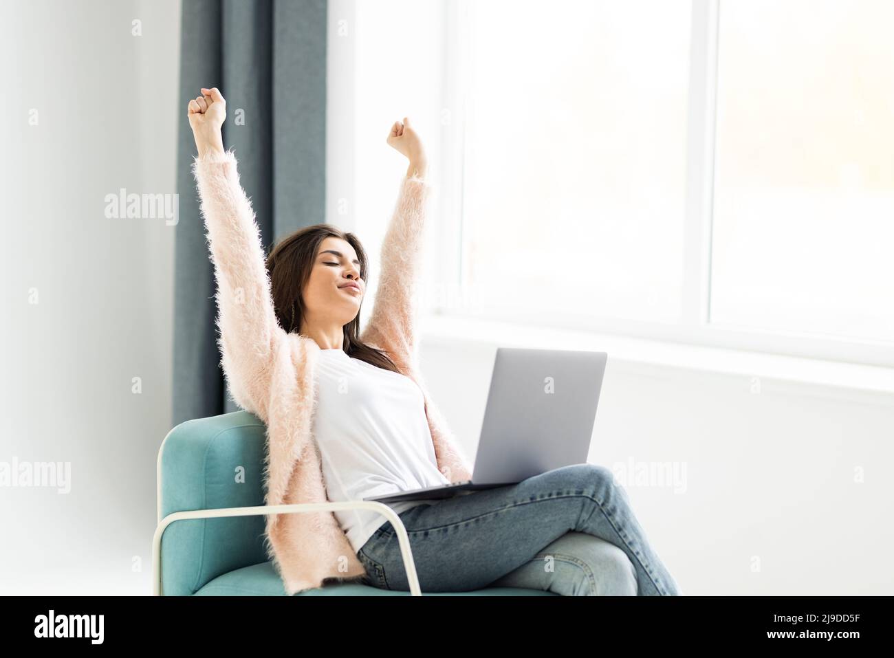 Enjoying relaxing time after work at home. Freelance winner concept ...