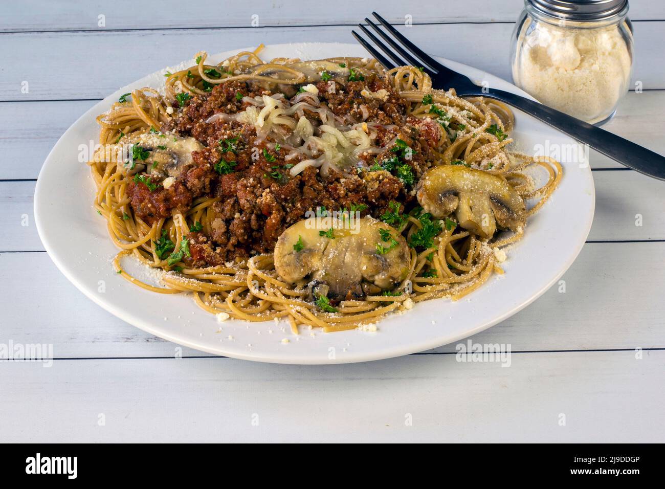 whole wheat spaghetti served with hamburg sauce and chese, parsley ...