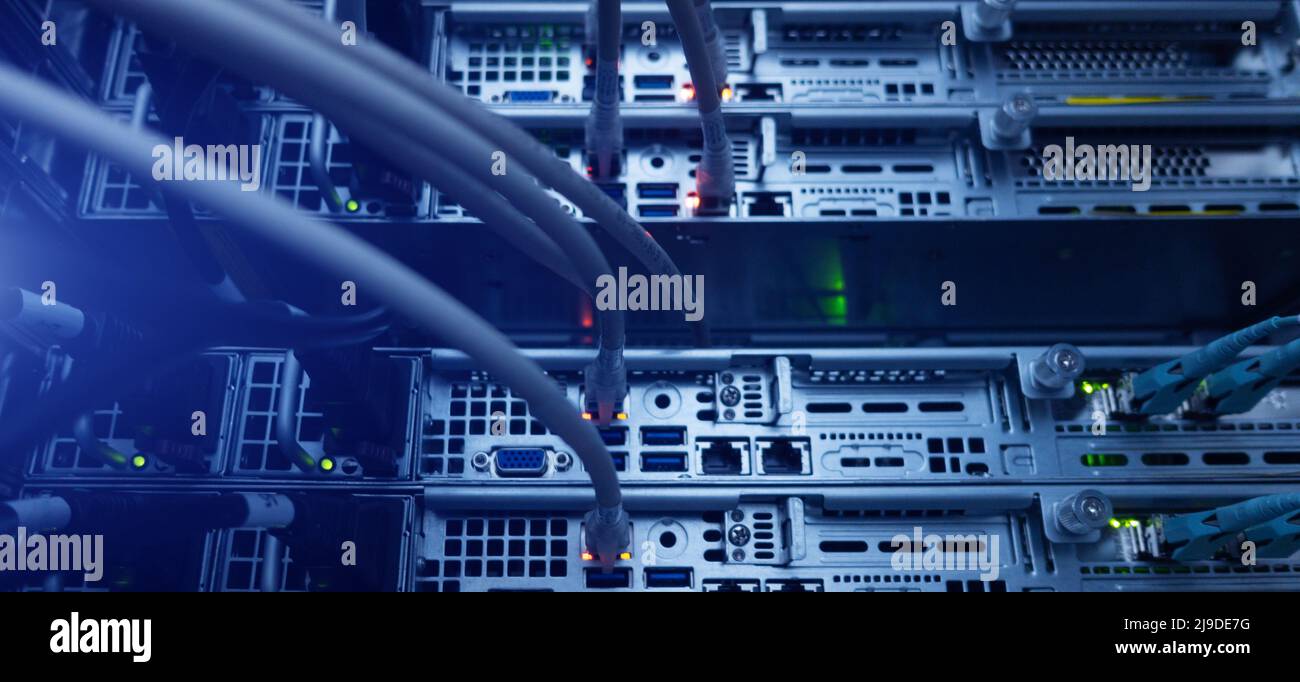 Ethernet and Optical cables connected to ports on enumerated patch ...