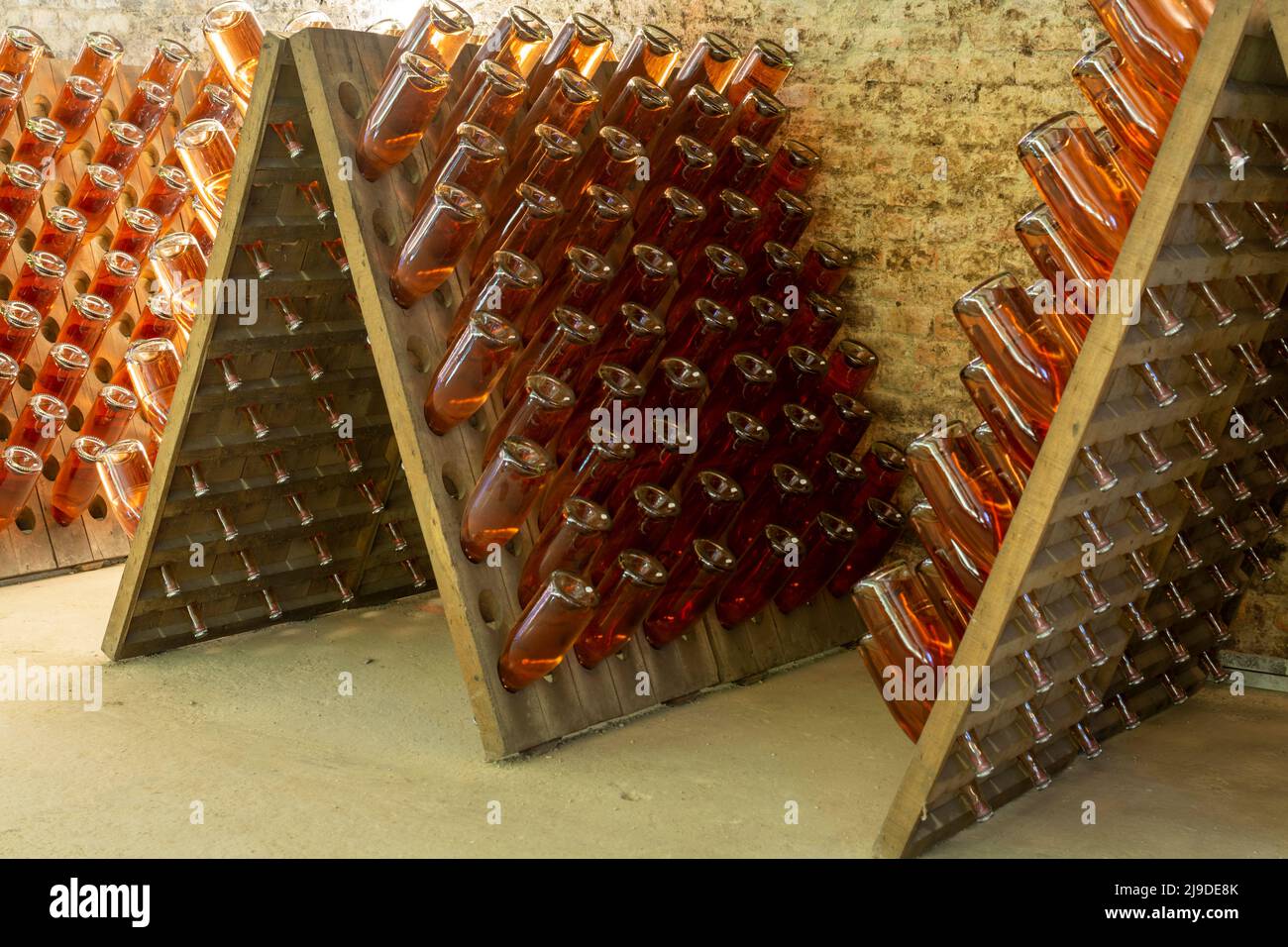 Sparkling dry rose wine production by traditional method in underground ...